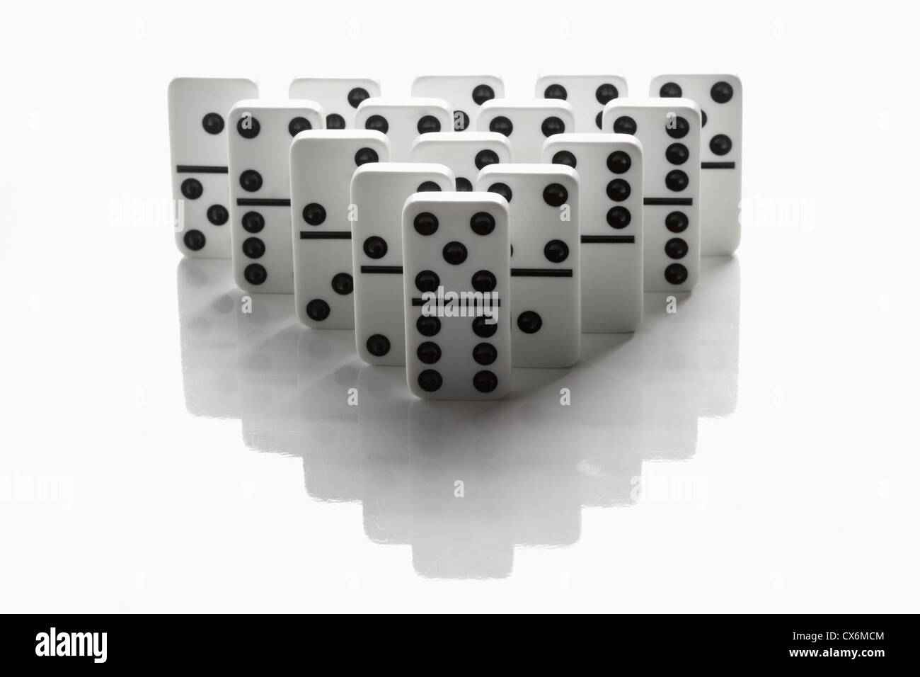 Dominoes arranged in the shape of a triangle Stock Photo - Alamy
