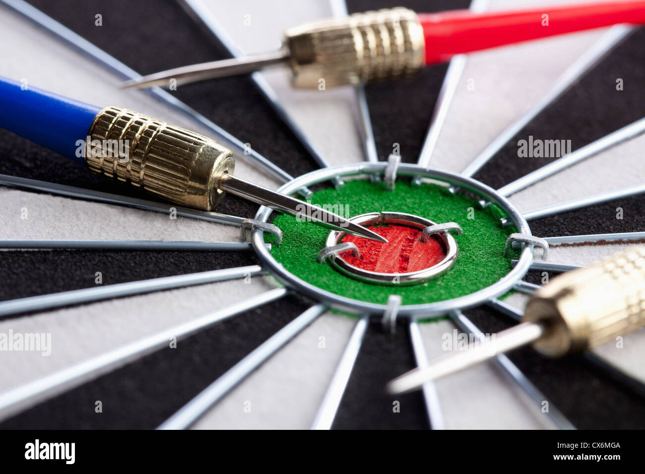 Three darts lying on dartboard hi-res stock photography and images - Alamy
