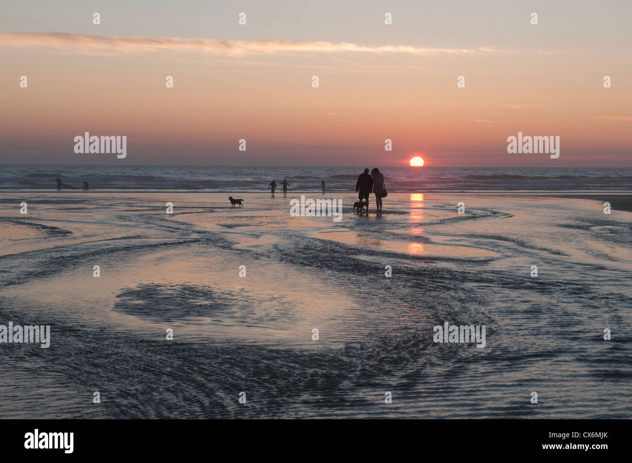On the beach beyond Chapel Rock at Perranporth, Cornwall, UK. Sunset ...