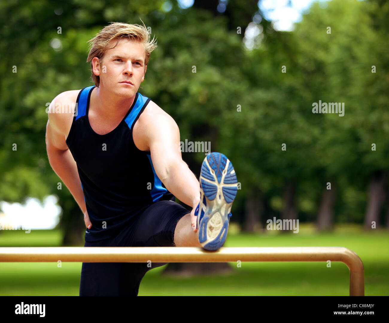 Handsome athlete with a serious expression on his face doing his ...