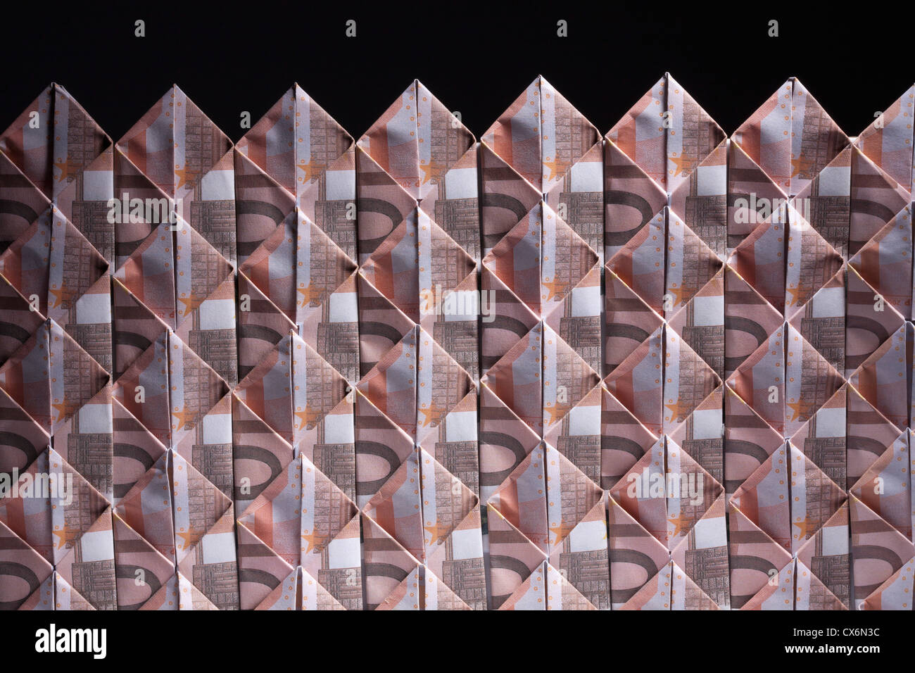 Ten Euro banknotes folded into diamond shapes and interwoven Stock ...