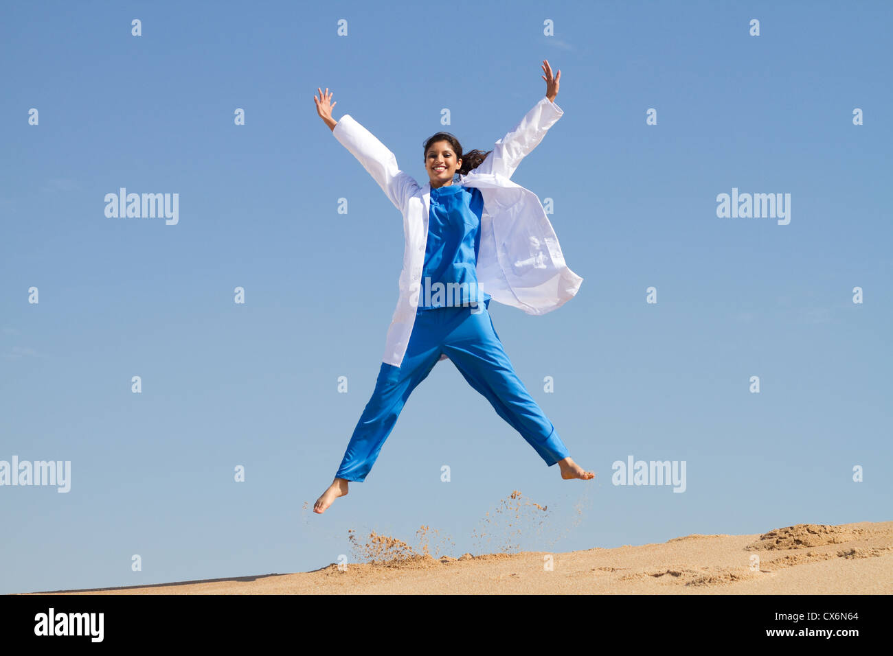 happy nurse jumping Stock Photo - Alamy