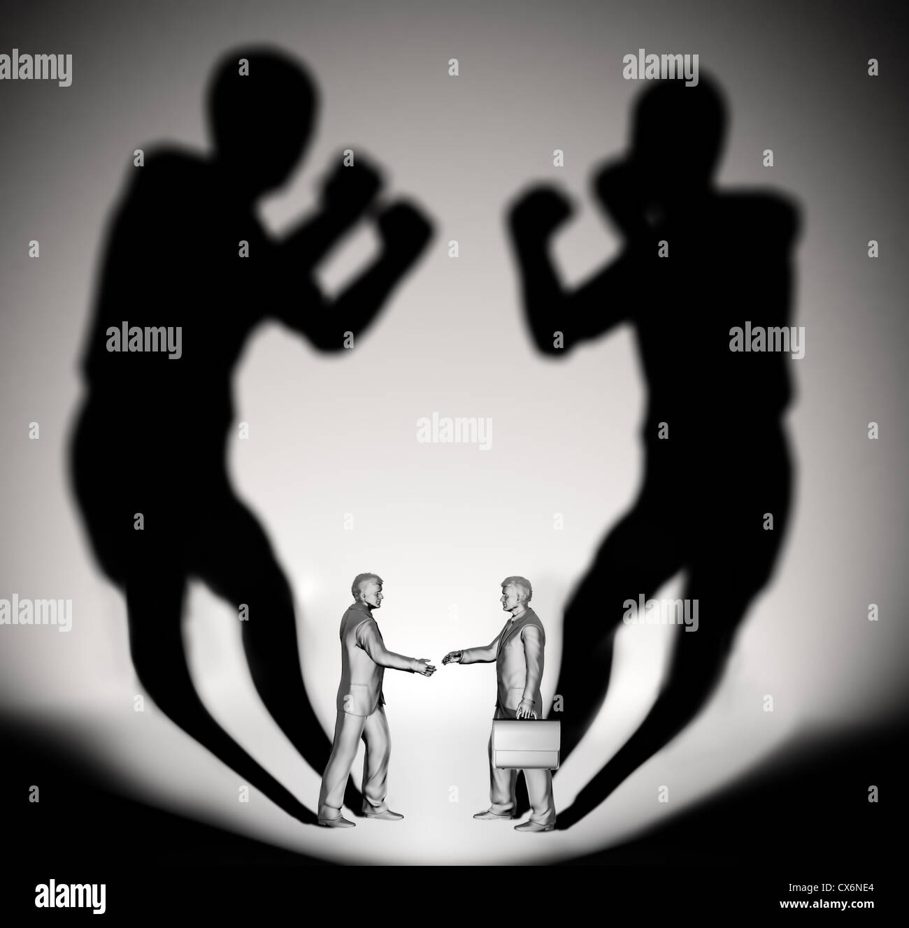 Two businessman casting a shadow shaped like two fighters Stock Photo ...