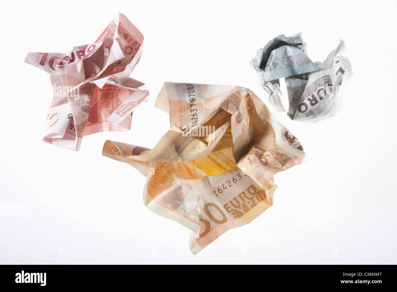 Crumpled Euro banknotes on a white background Stock Photo - Alamy