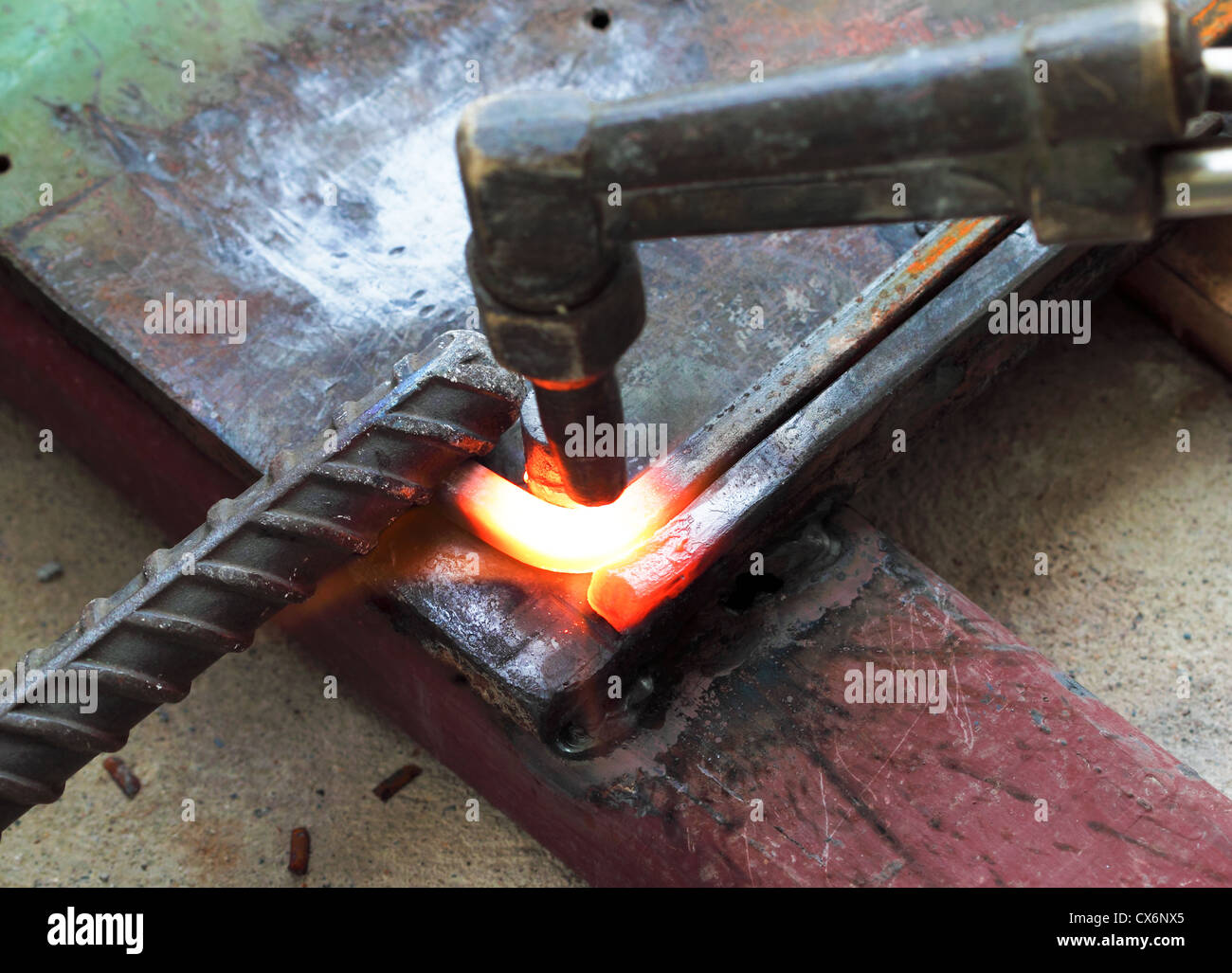 Gas heating cutting metal using torch and bending square bar Stock ...