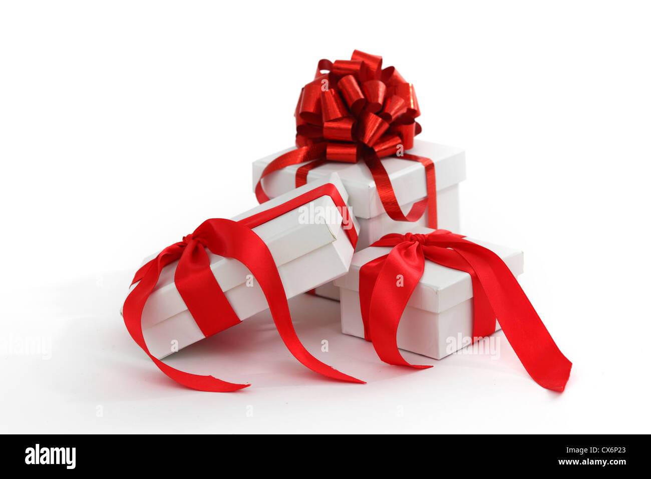white gift with red ribbon Stock Photo - Alamy