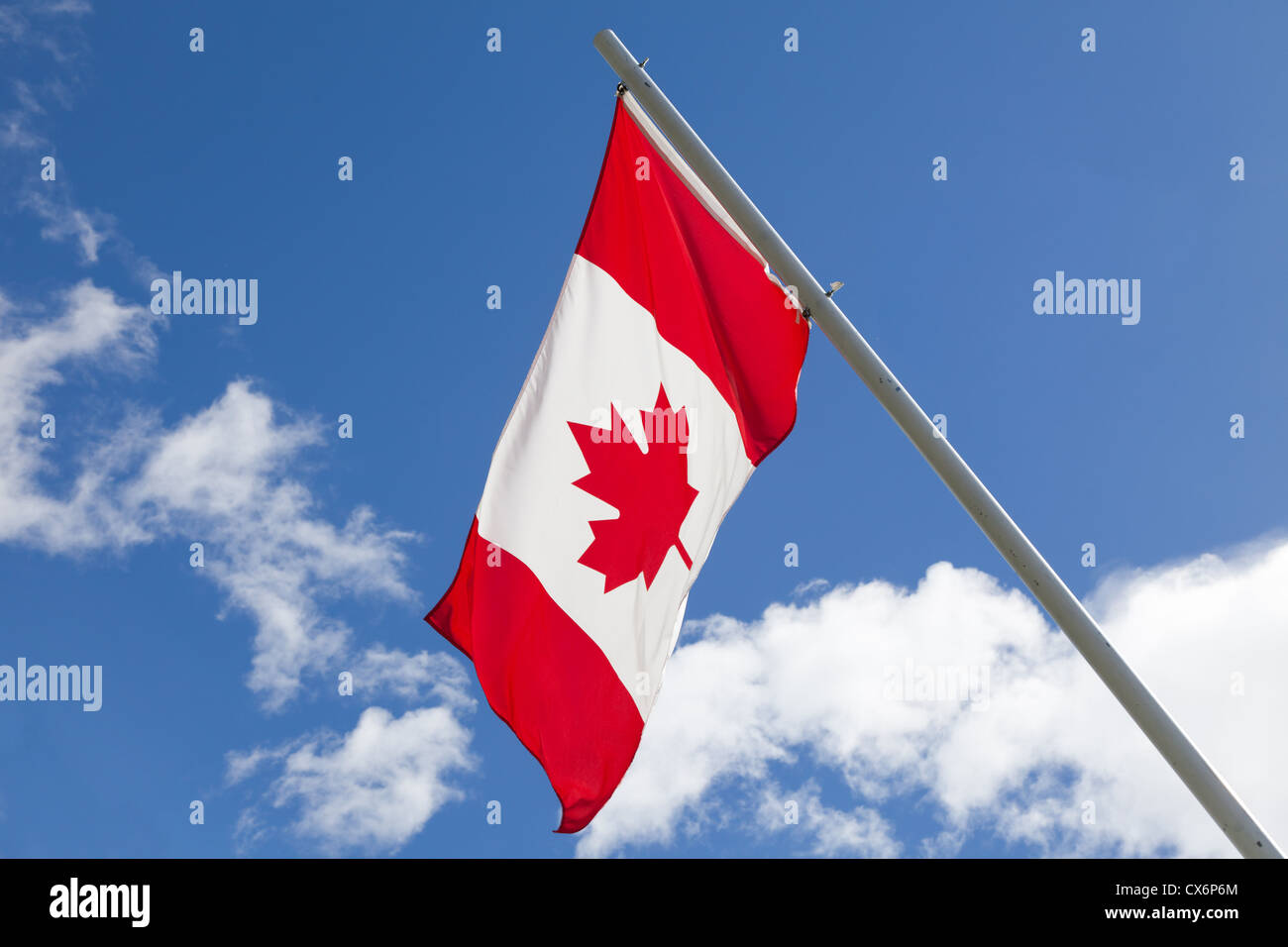 Canadian Flag with blue sky Stock Photo - Alamy