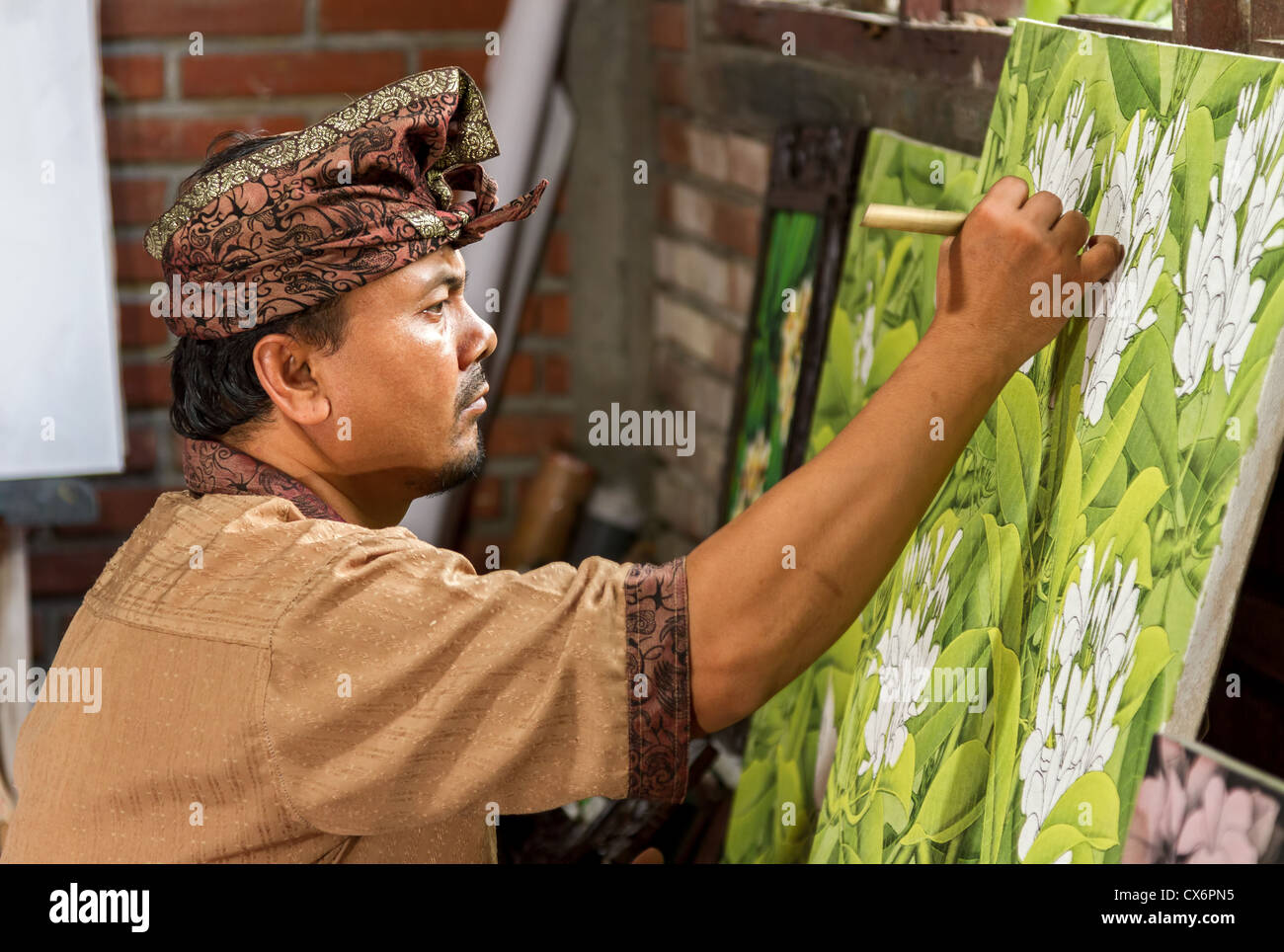 Painter drawing on easel in gallery, Ubud, Bali, Indonesia Stock Photo ...