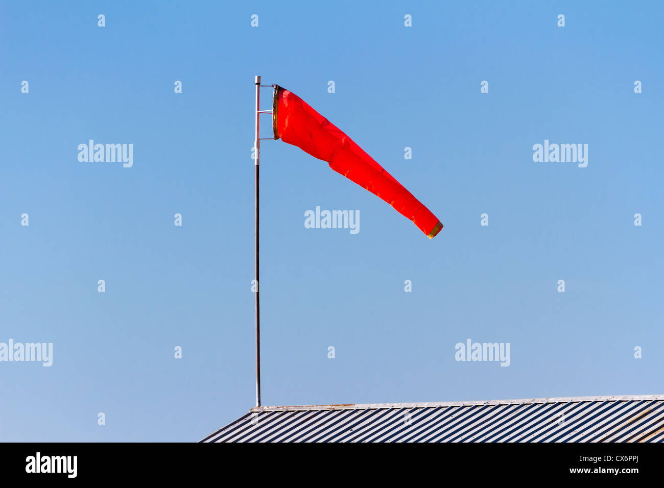 Red Windsock with blue sky Stock Photo - Alamy