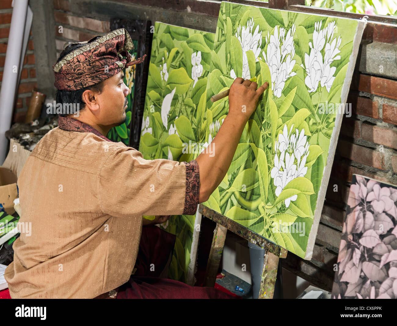Painter drawing on easel in gallery, Ubud, Bali, Indonesia Stock Photo ...