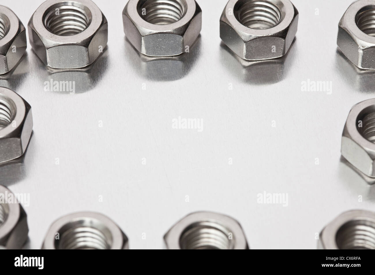 Metal nuts arranged in a circle Stock Photo - Alamy