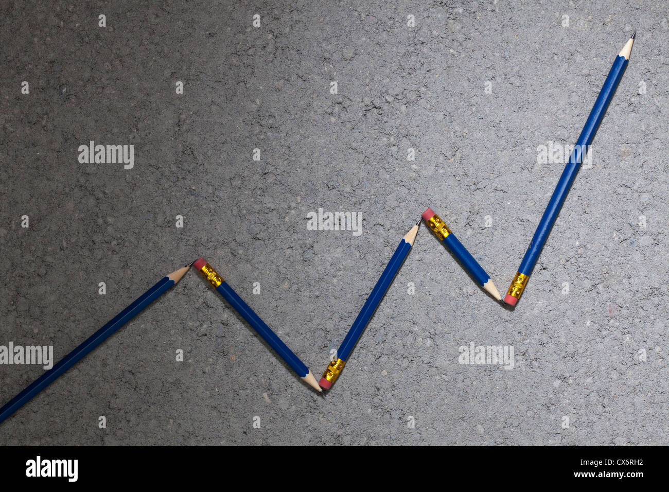 Pencils arranged to depict an ascending line graph Stock Photo - Alamy