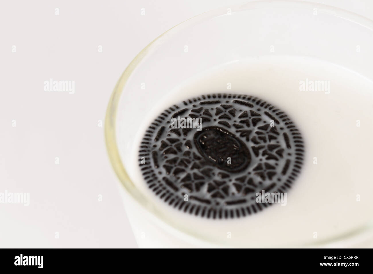 Cookie floating in milk Stock Photo - Alamy