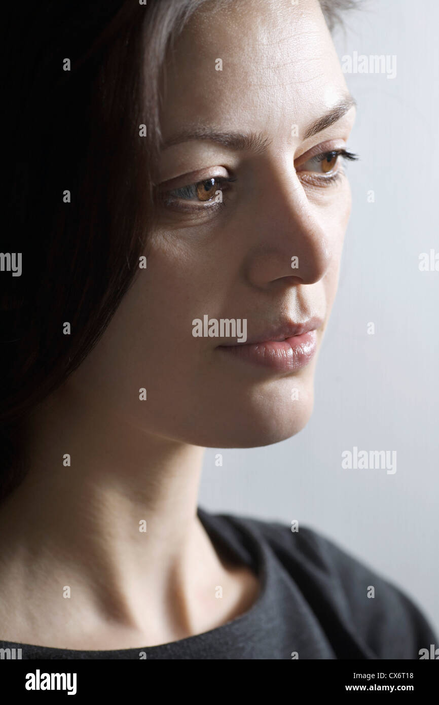 A woman looking away Stock Photo - Alamy