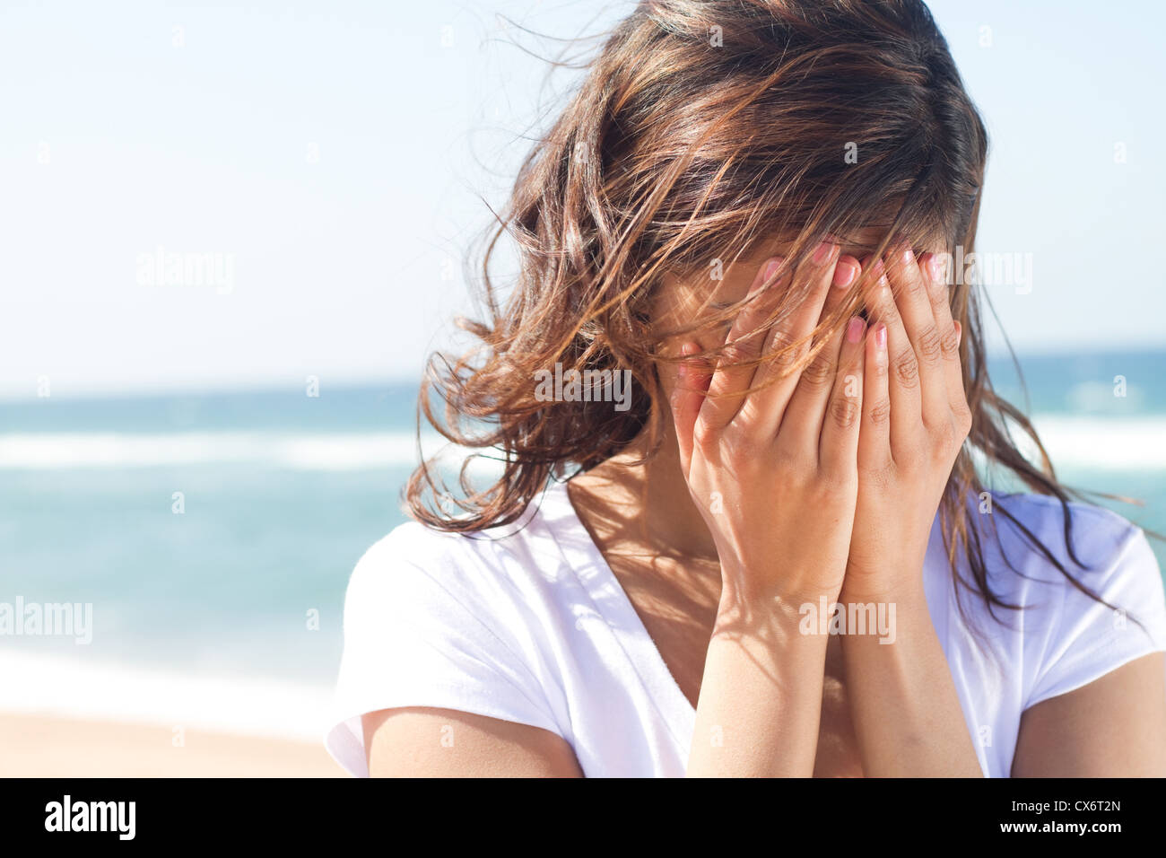 young woman cover her face with hands crying Stock Photo - Alamy
