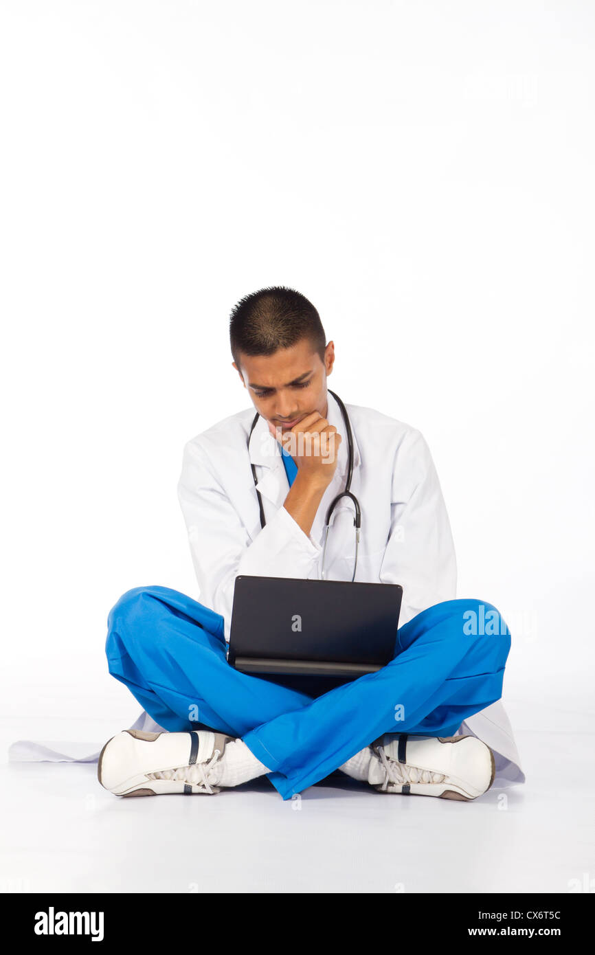 thoughtful indian medical intern working on laptop Stock Photo - Alamy