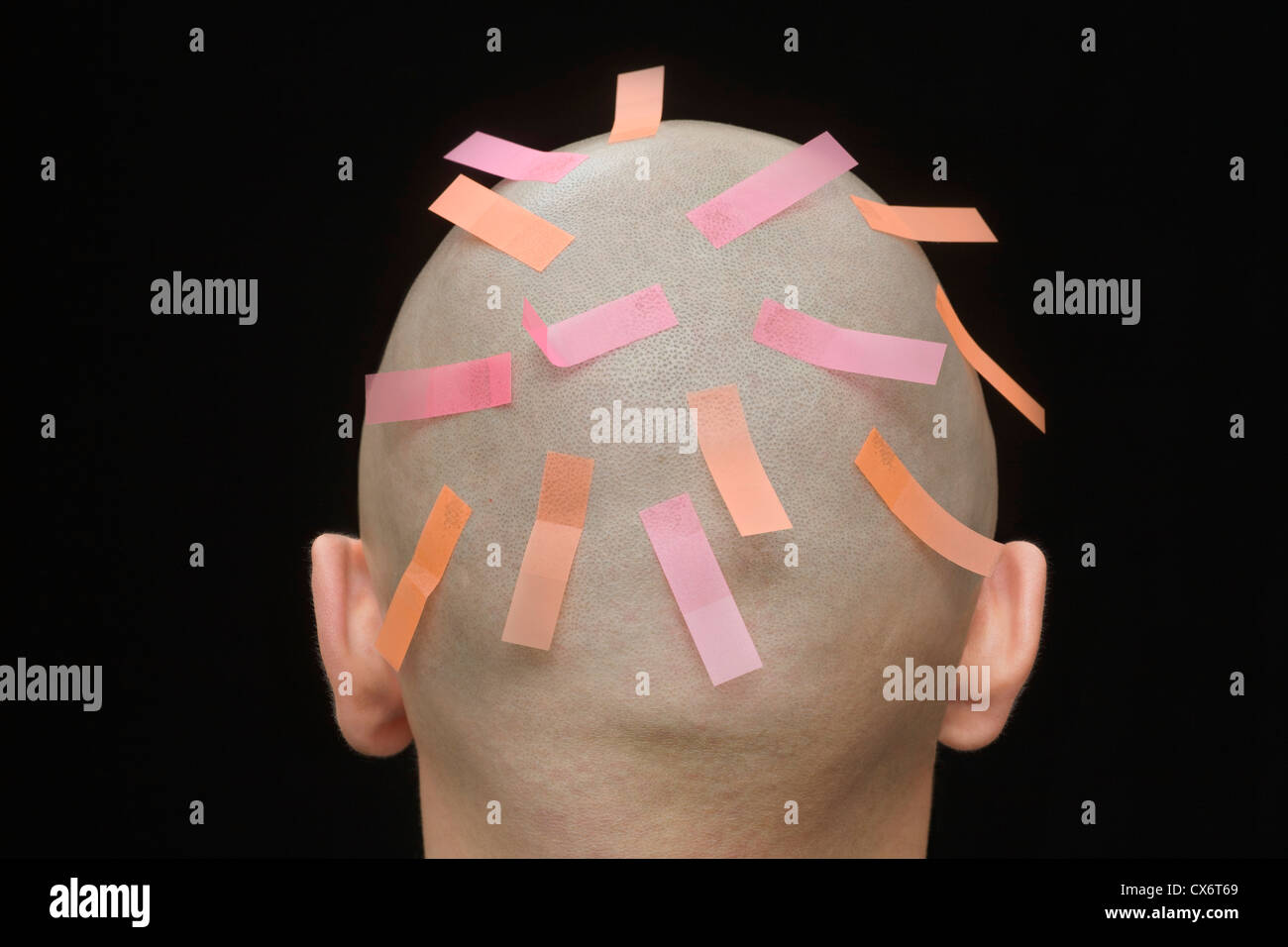Adhesive tabs on the head of a man, rear view Stock Photo - Alamy