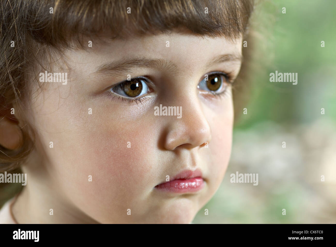 Close-up of a young girl staring Stock Photo - Alamy