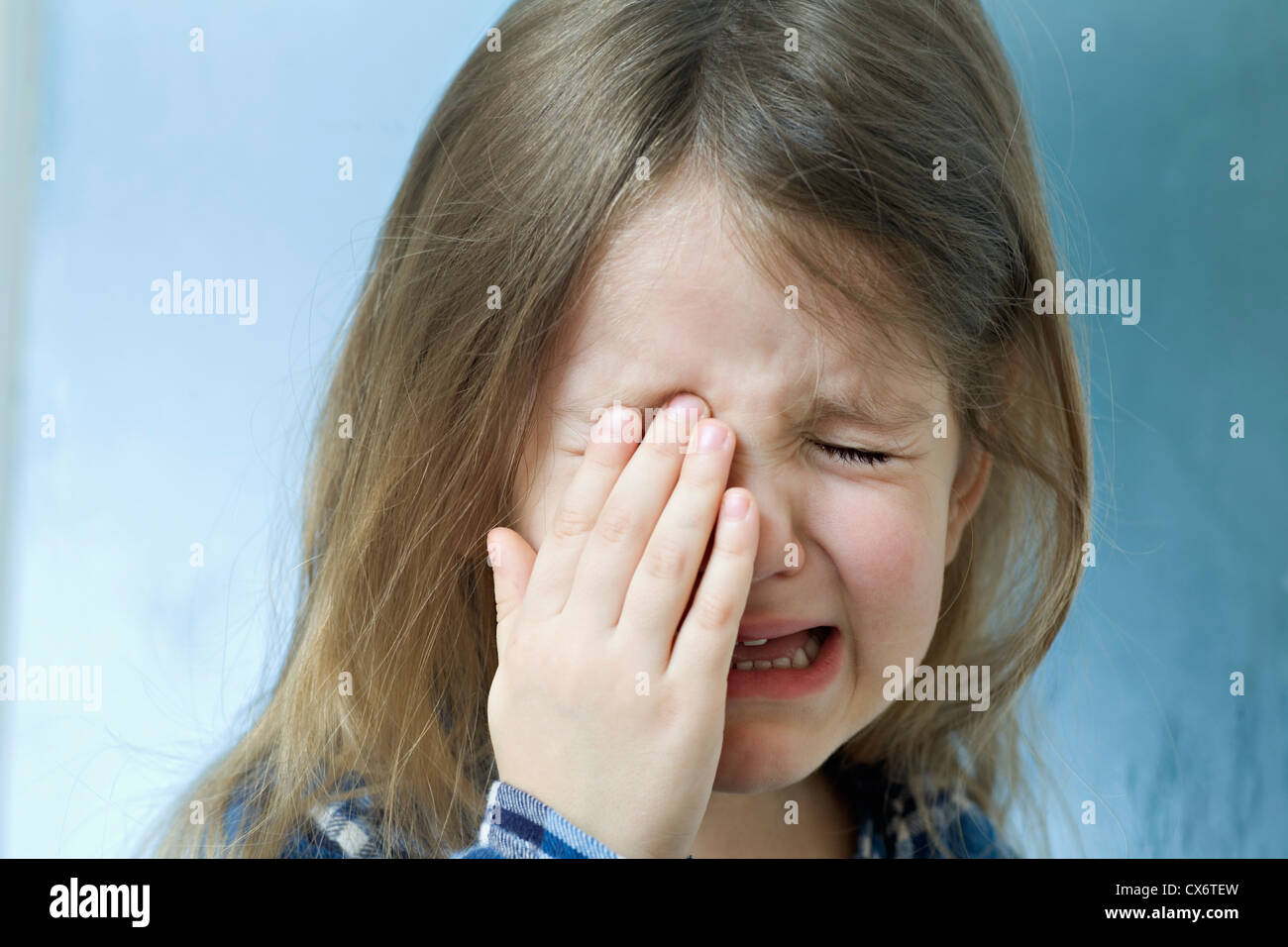 Close-up of a young girl crying Stock Photo - Alamy