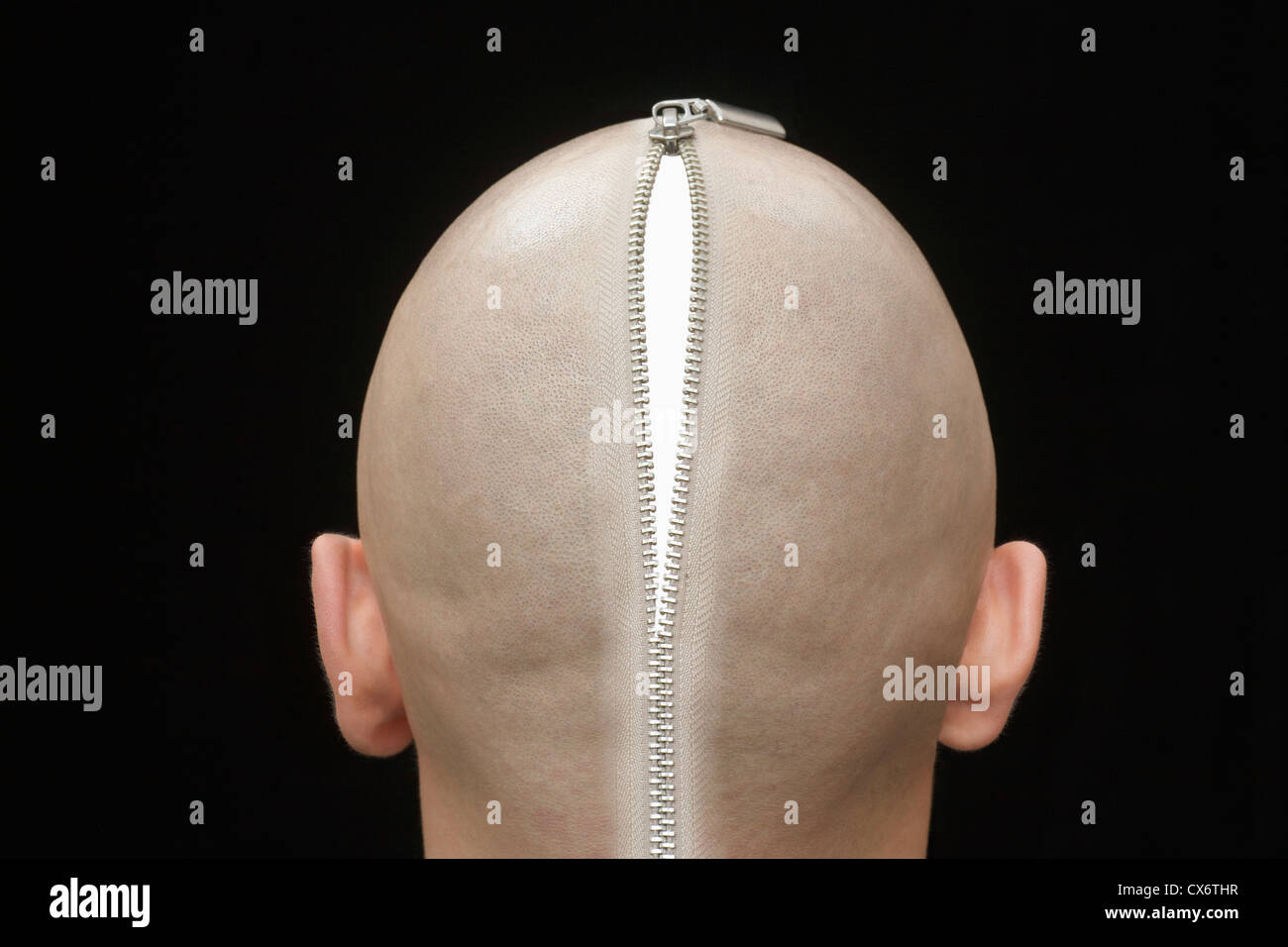 An open zip on the head of a man, rear view Stock Photo - Alamy