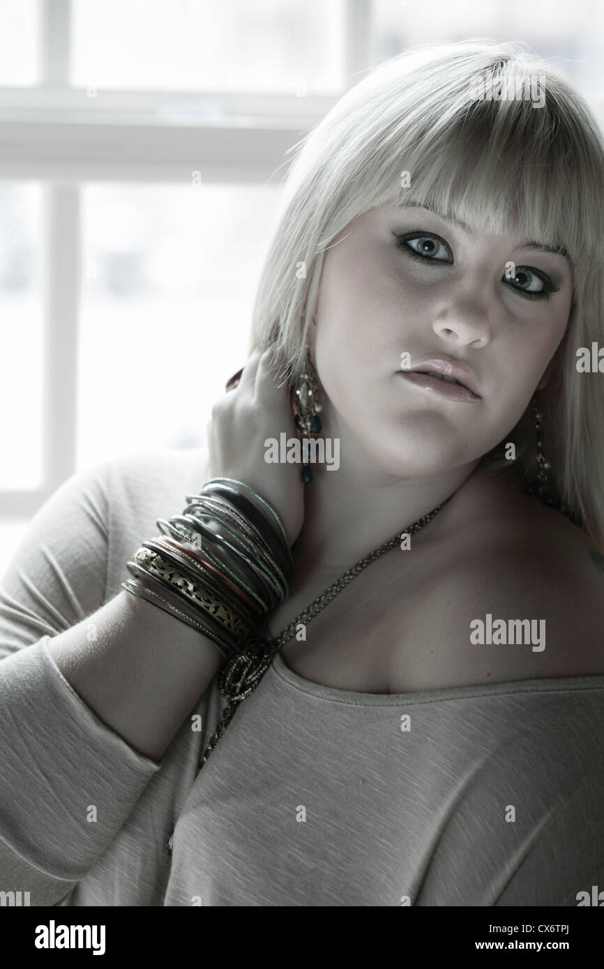 Woman by the window Stock Photo - Alamy