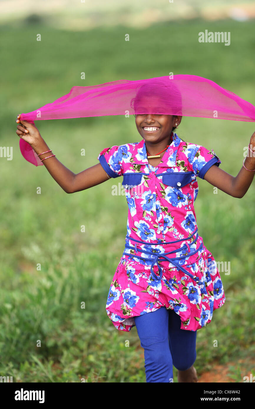 Indian girl running in a field Andhra Pradesh South India Stock Photo ...