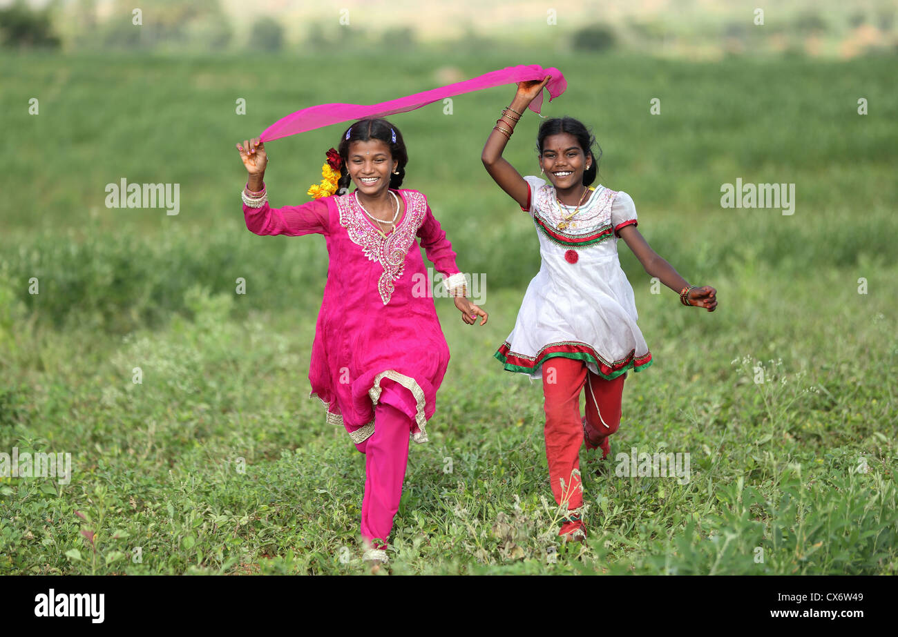 Indian girls running in a field Andhra Pradesh South India Stock Photo ...