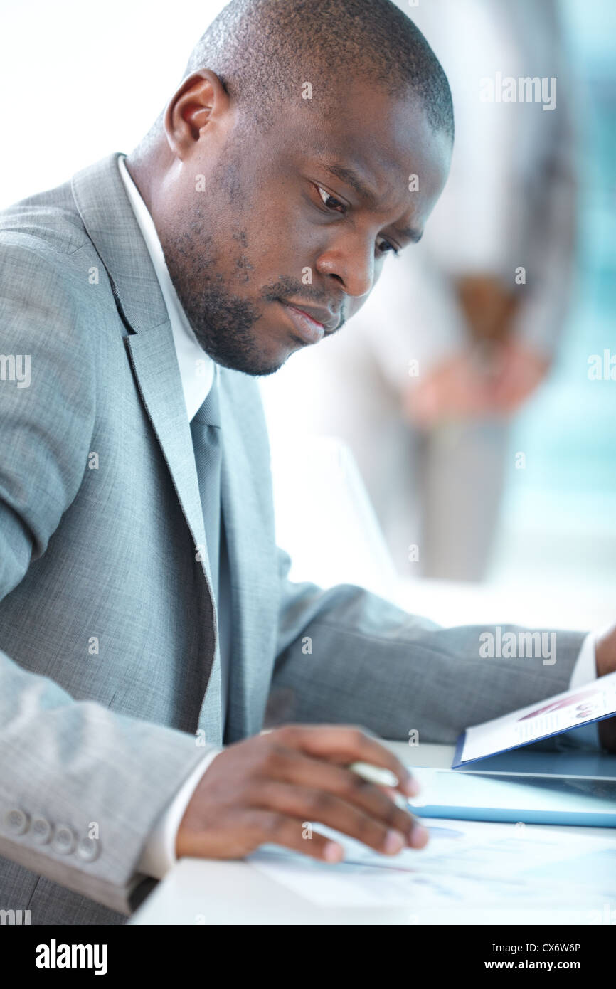 Portrait of busy leader working with papers Stock Photo - Alamy