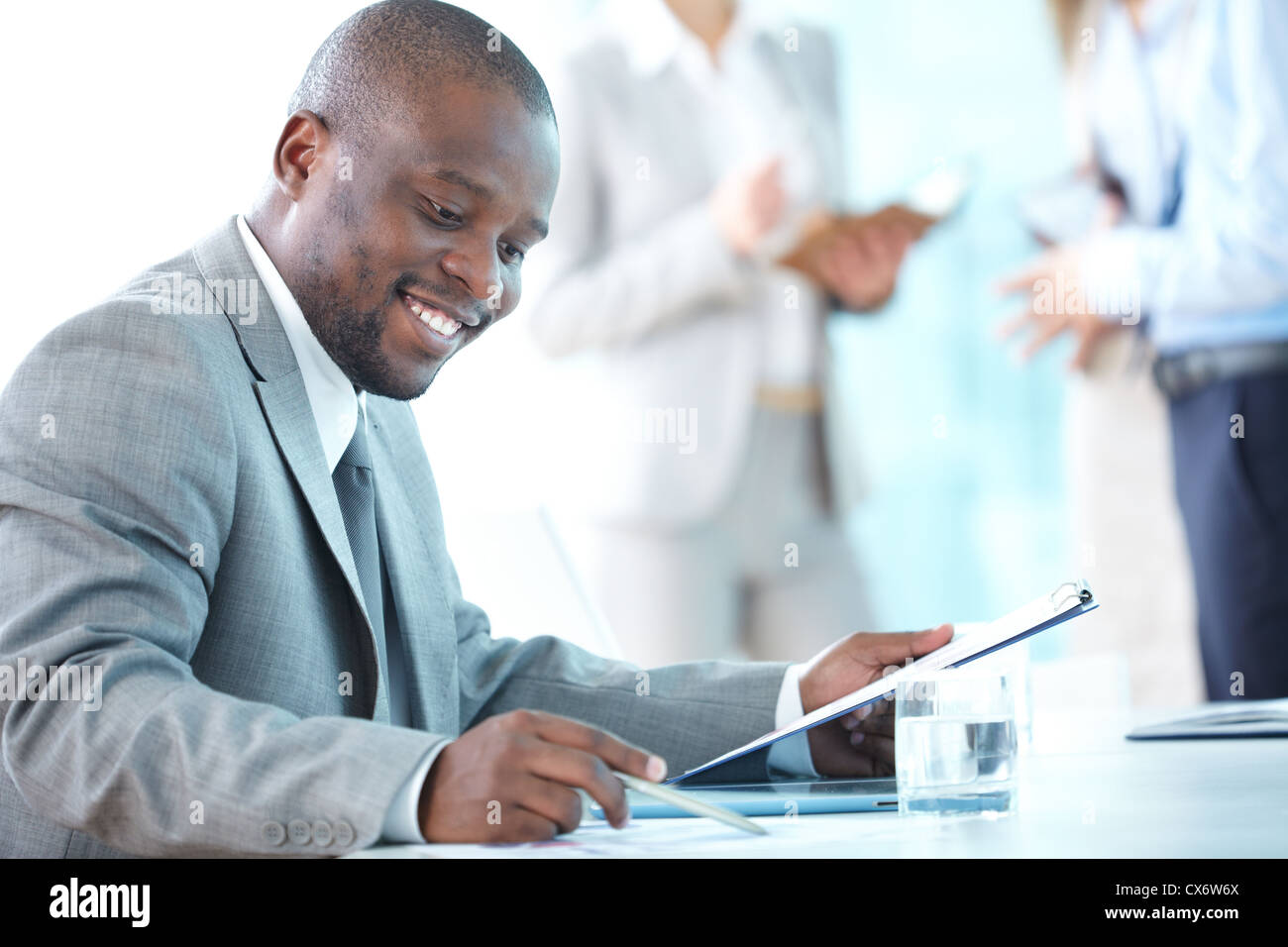 Portrait of busy leader working with papers Stock Photo - Alamy