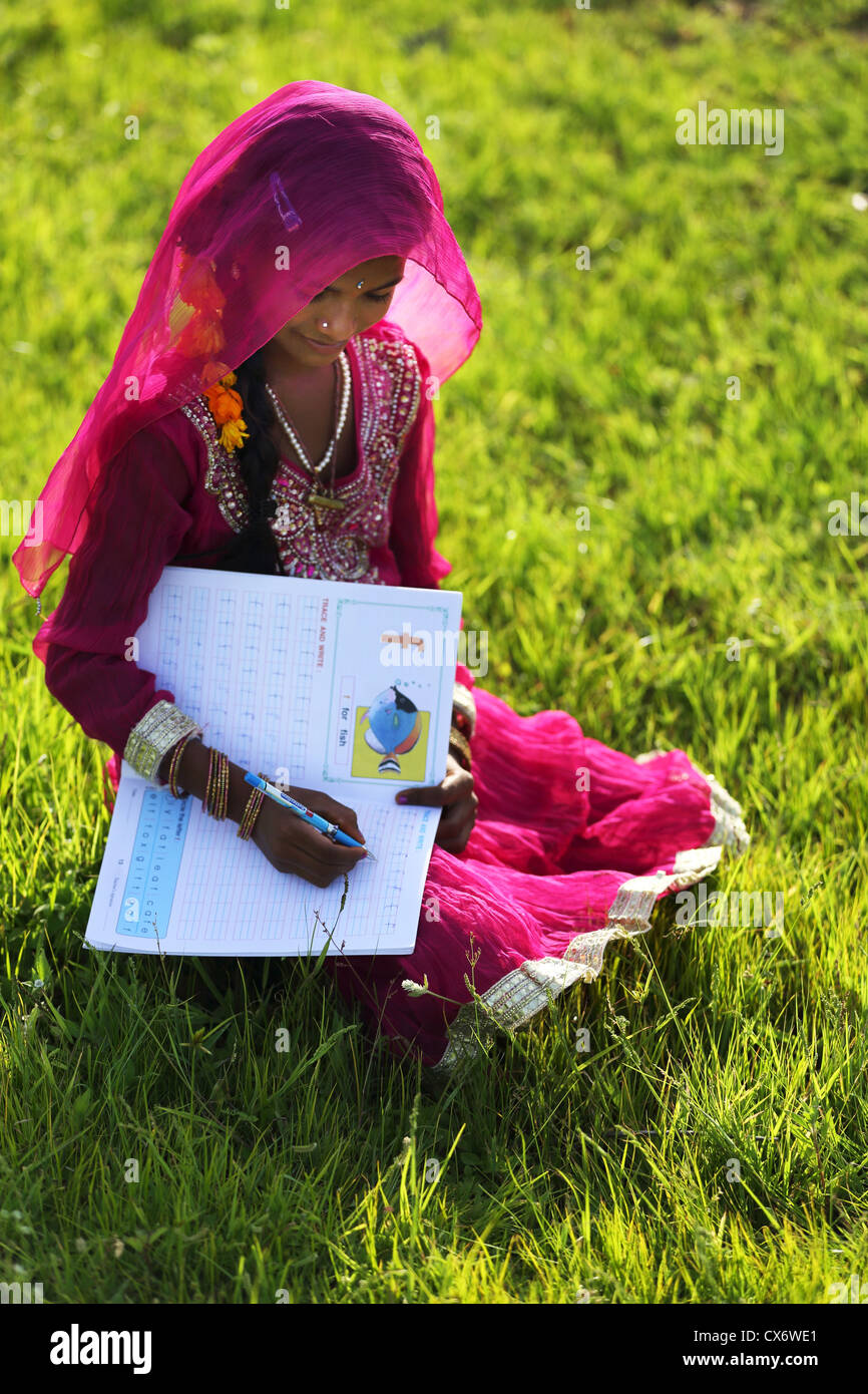 Indian girl writing in her notebook Andhra Pradesh South India Stock ...