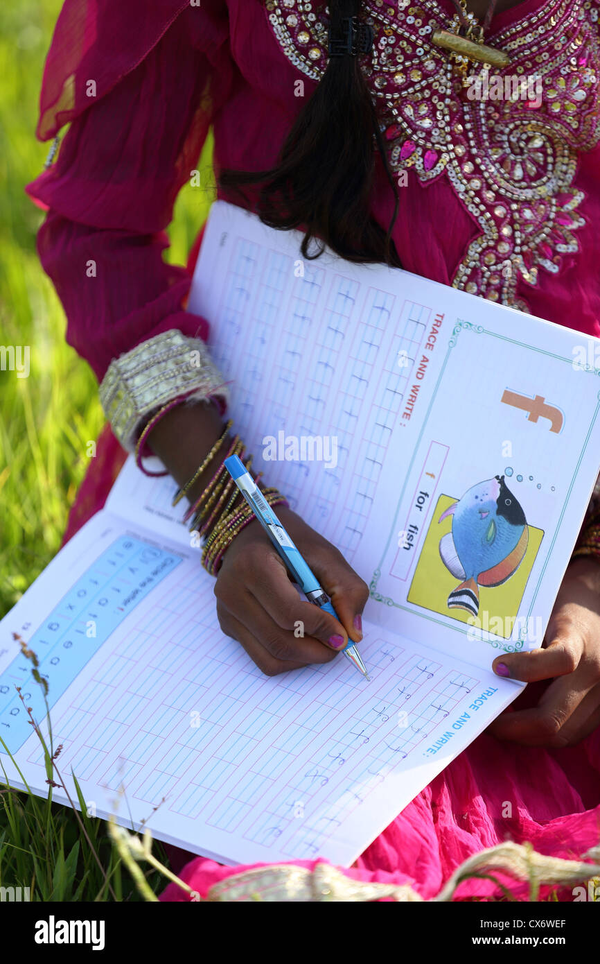 Indian girl writing in her notebook Andhra Pradesh South India Stock ...
