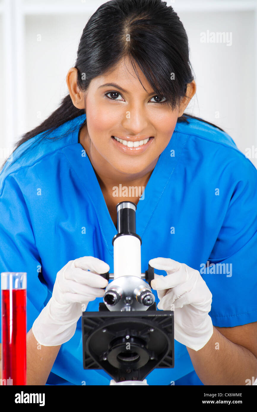 young lab technician using microscope Stock Photo - Alamy