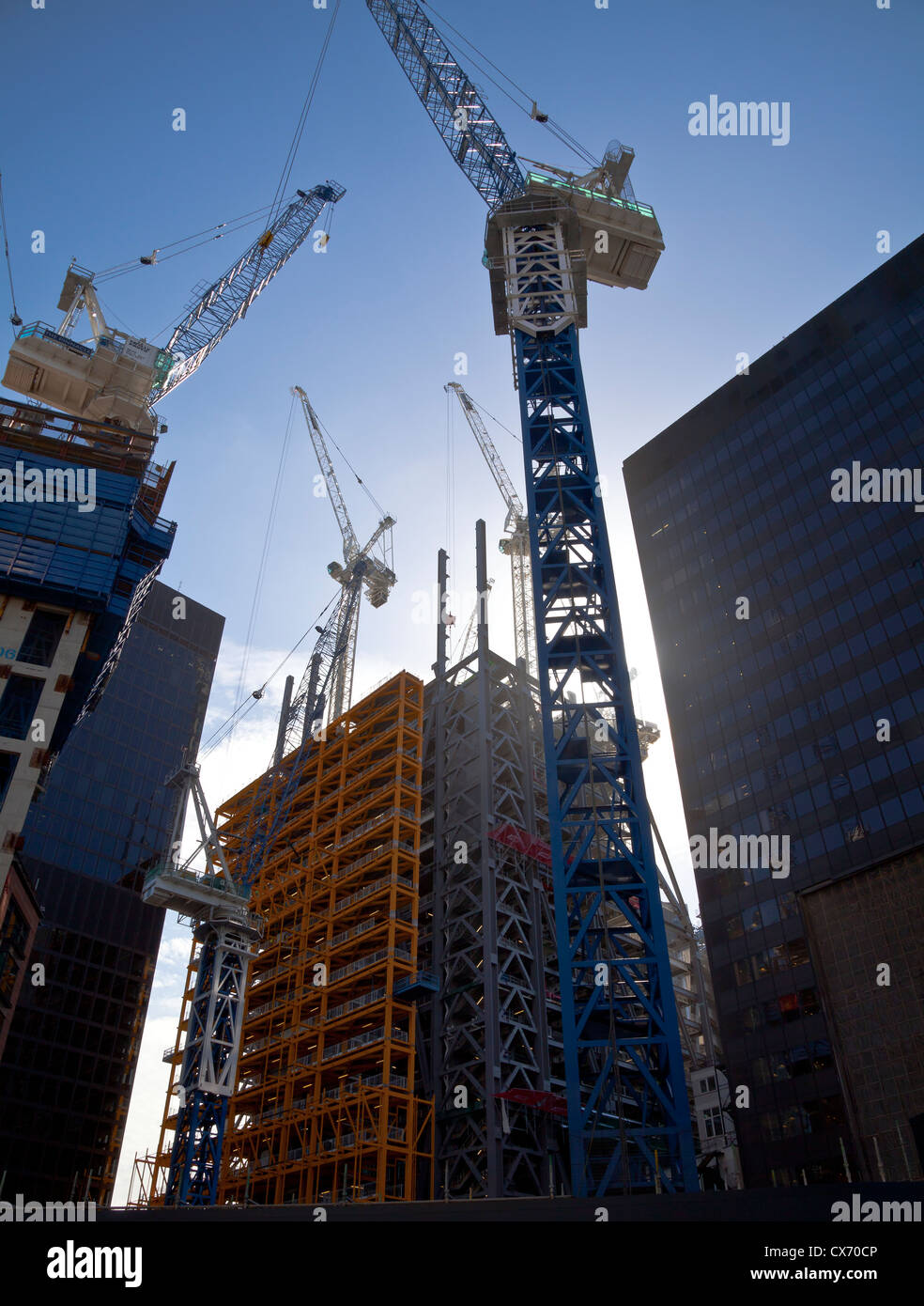 Sun rising over a building site Stock Photo - Alamy
