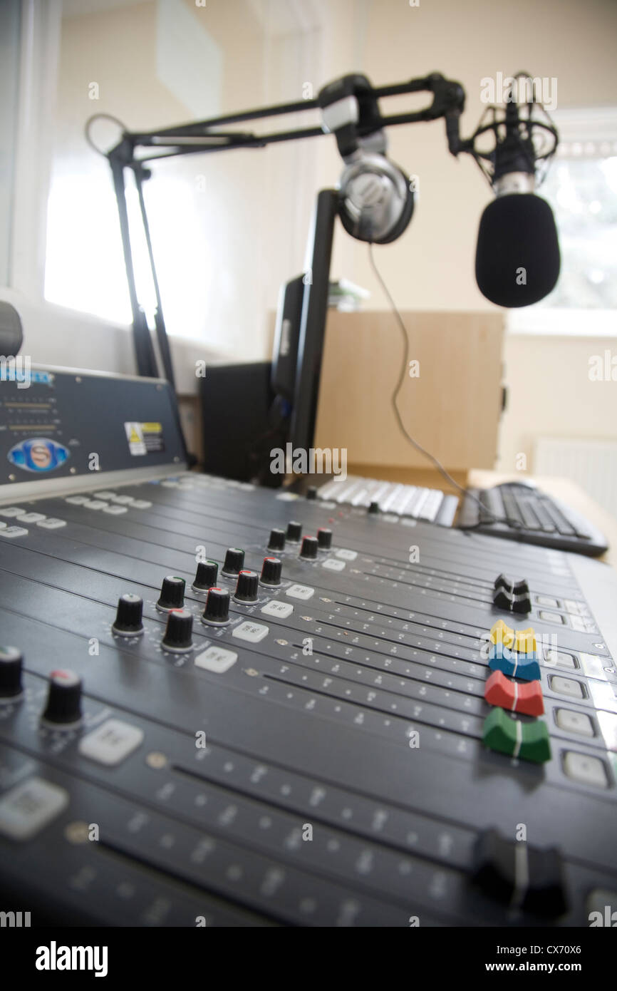 Sound desk with faders and microphone in recording studio Stock Photo ...