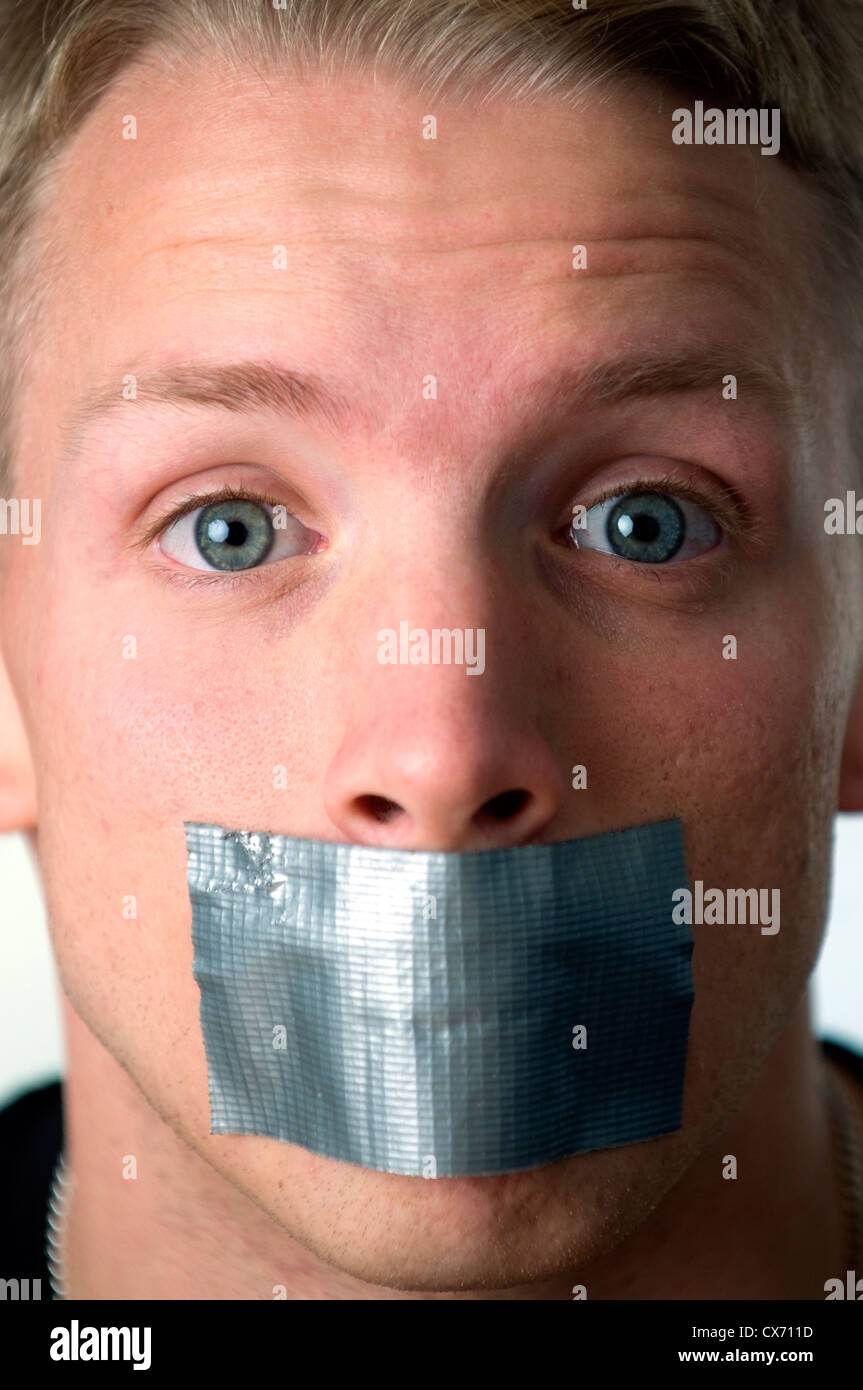 young man with mouth taped Stock Photo - Alamy
