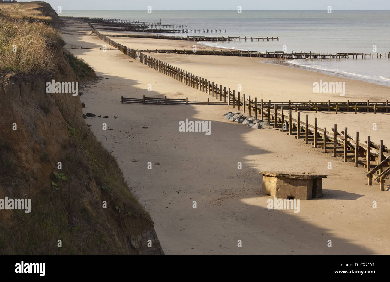 Groynes smashed by wave power north sea coast at Happisburgh Norfolk UK ...