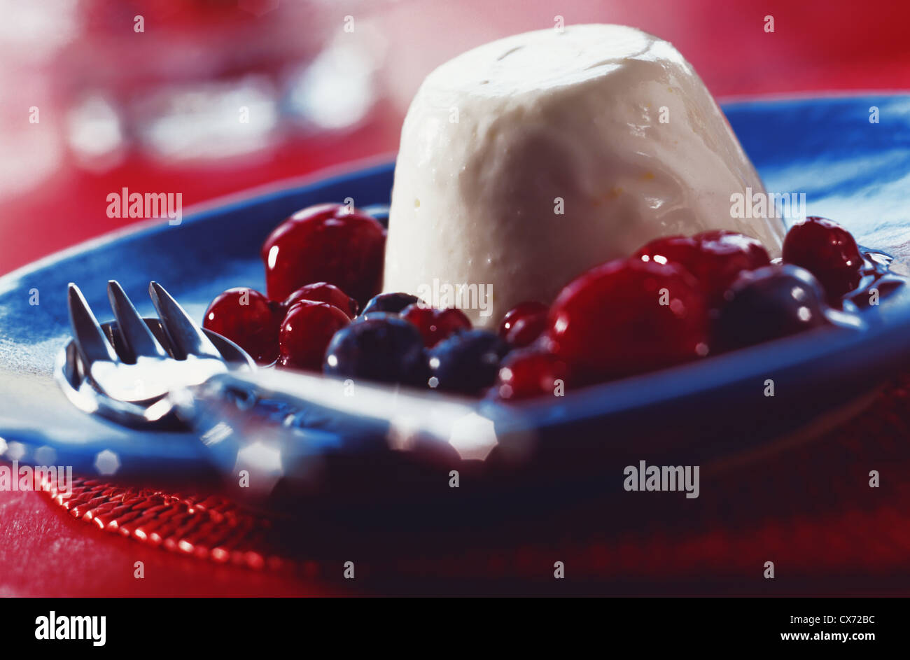 Buttermilk mousse with red fruit jelly Stock Photo - Alamy
