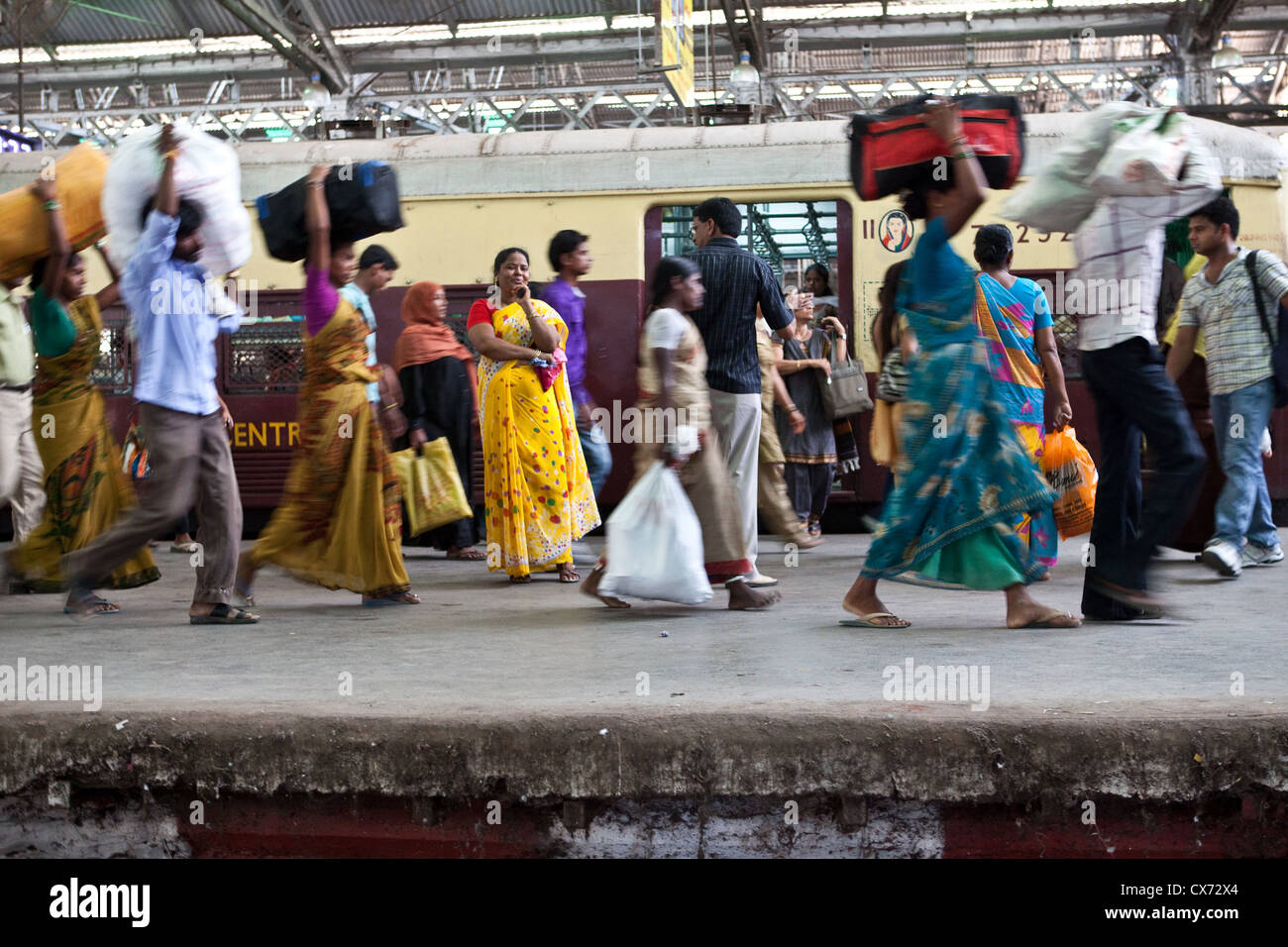 Passengers on the platform departing a train at Victoria Terminus in ...