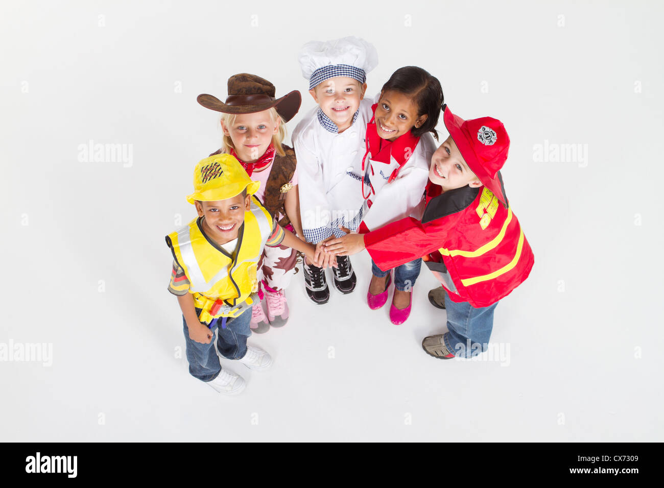 overhead view of kids in occupational uniforms teamwork Stock Photo - Alamy