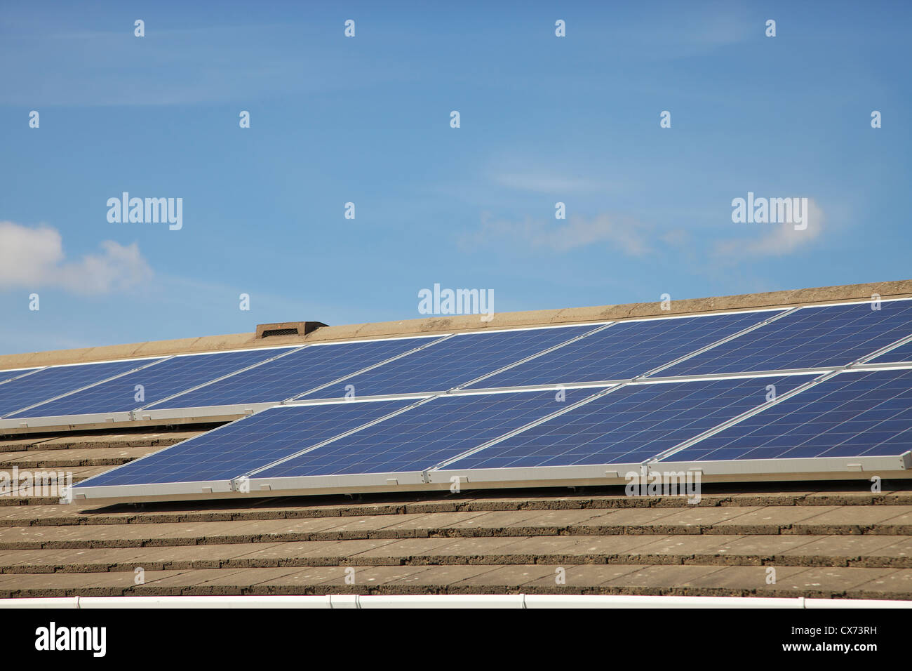 Solar panels on roof with blue sky Stock Photo - Alamy