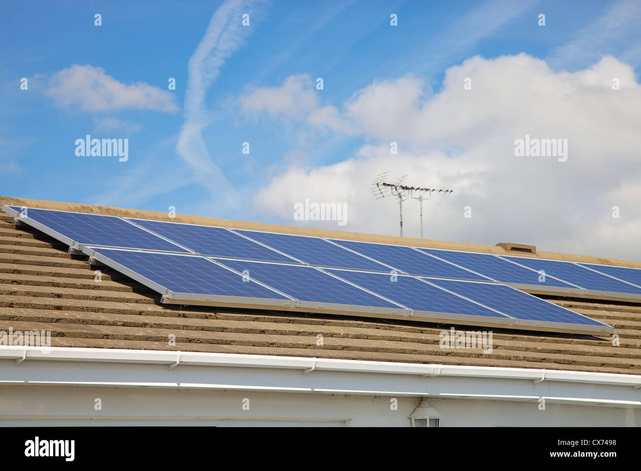 Solar panels on roof with blue sky Stock Photo - Alamy