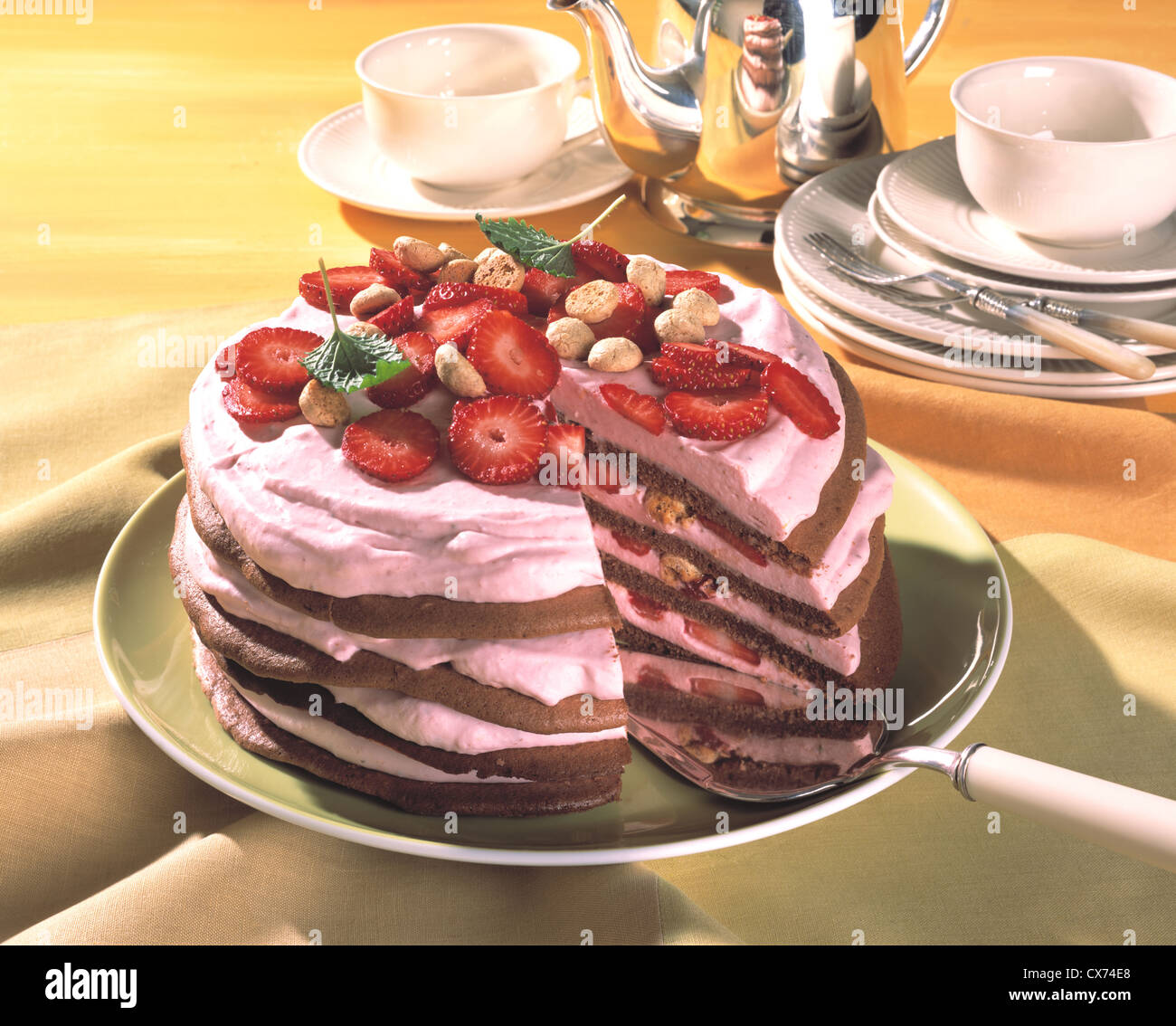 Layered strawberry cream cake with coffee pastry base Stock Photo - Alamy
