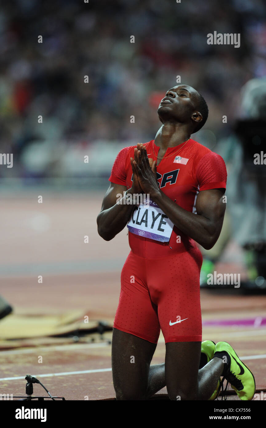 Will Claye assumes an attitude of prayer after completing the long jump at the Olympic Stadium ...