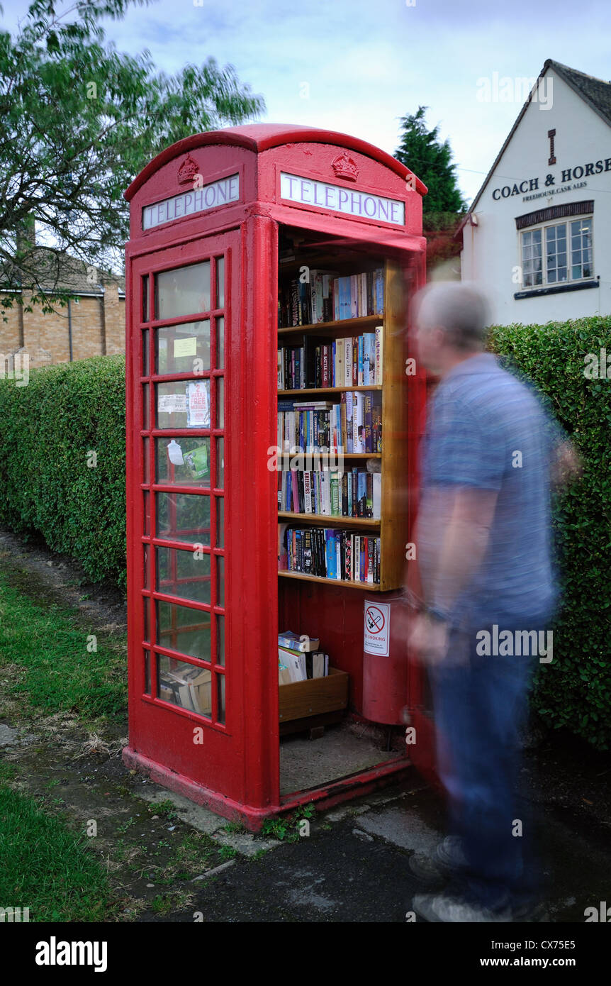 UK red telephone box used as a village library Stock Photo - Alamy