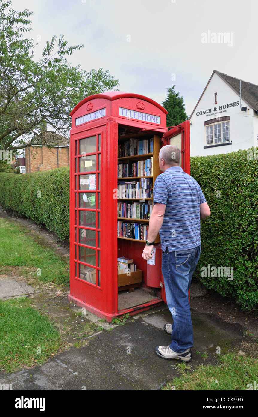 UK red telephone box used as a village library Stock Photo - Alamy