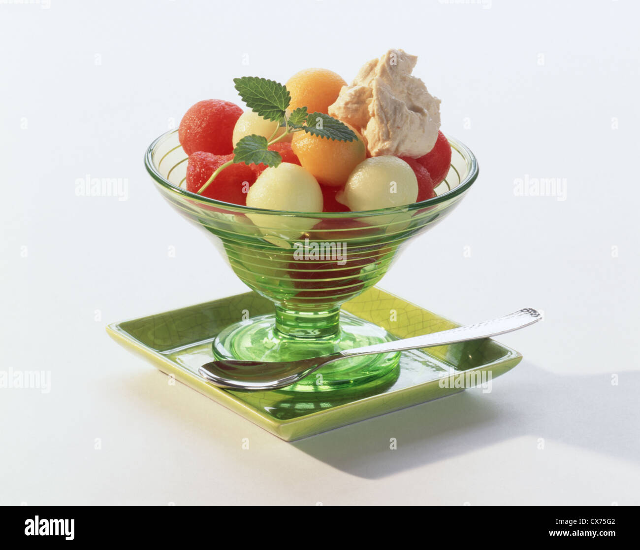 Melon salad with almond cream Stock Photo - Alamy