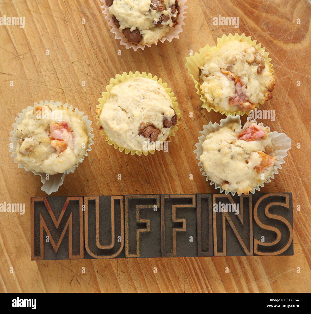 the word muffins in old letterpress type with assorted fruit and nut ...