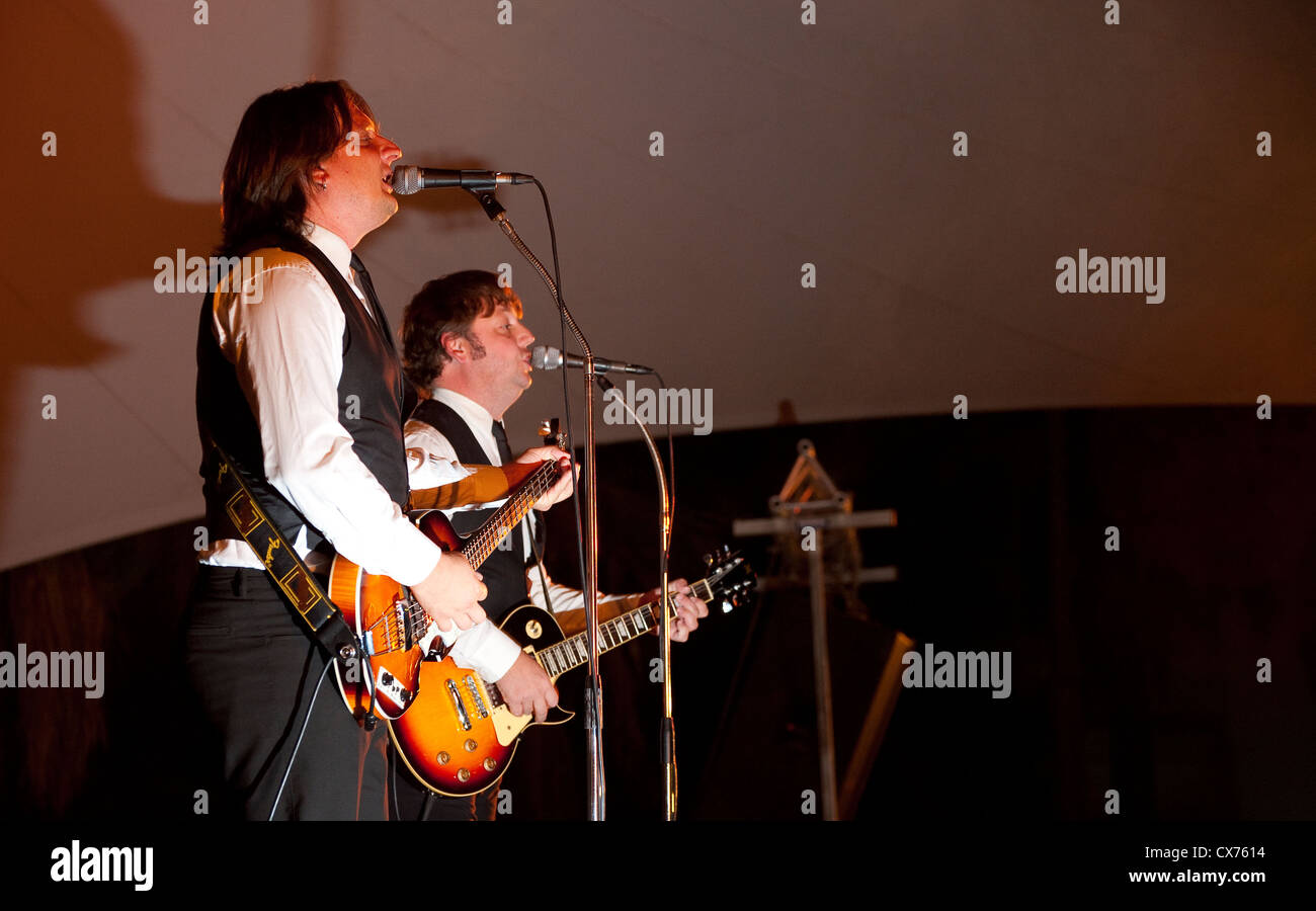 Singers performing on a stage Stock Photo - Alamy