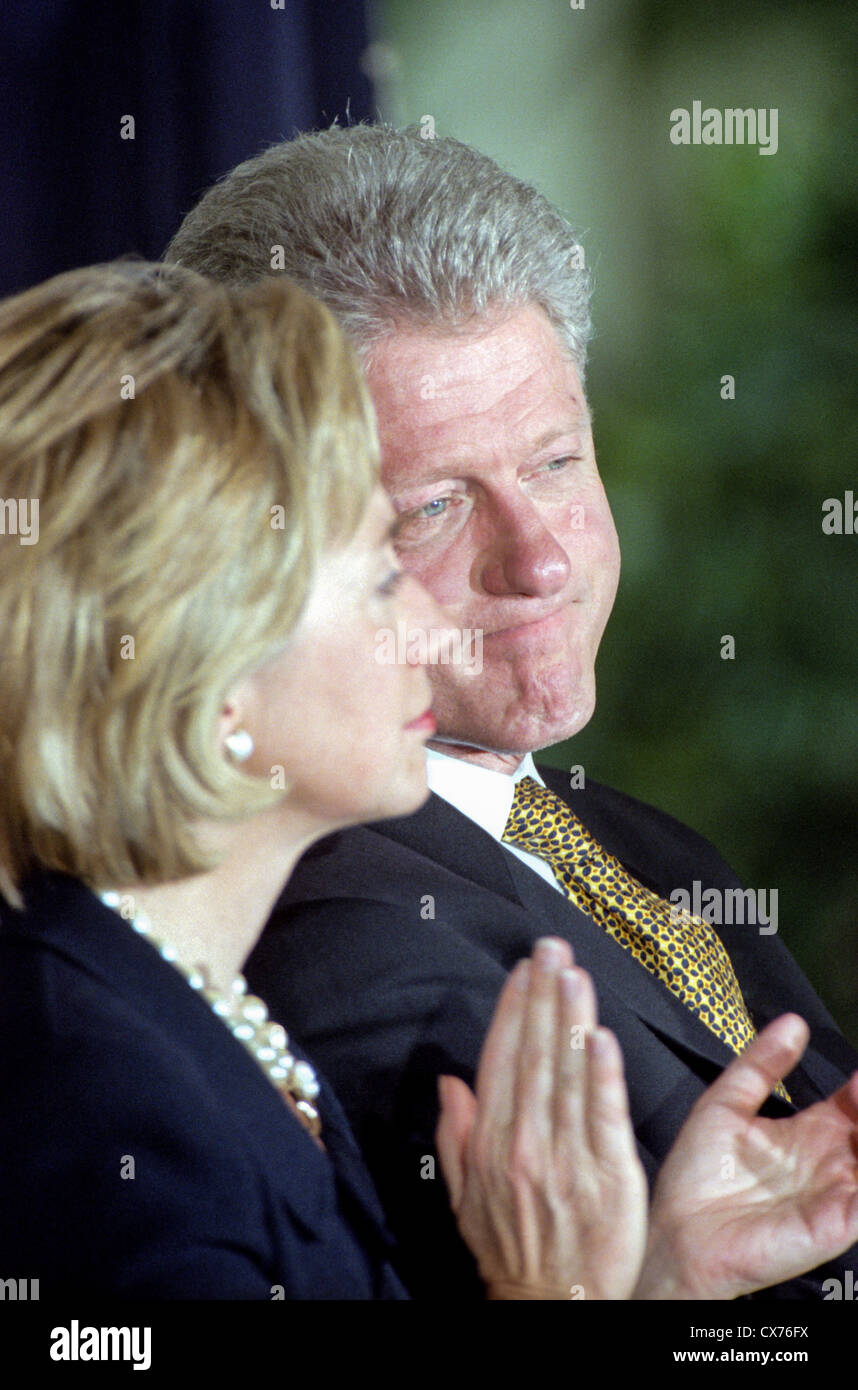 US President Bill Clinton with wife Hillary react during a ceremony on ...