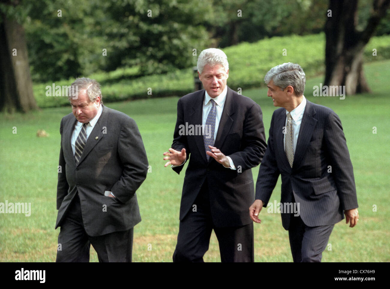 President Bill Clinton walks along with Treasury Secretary Robert Rubin ...